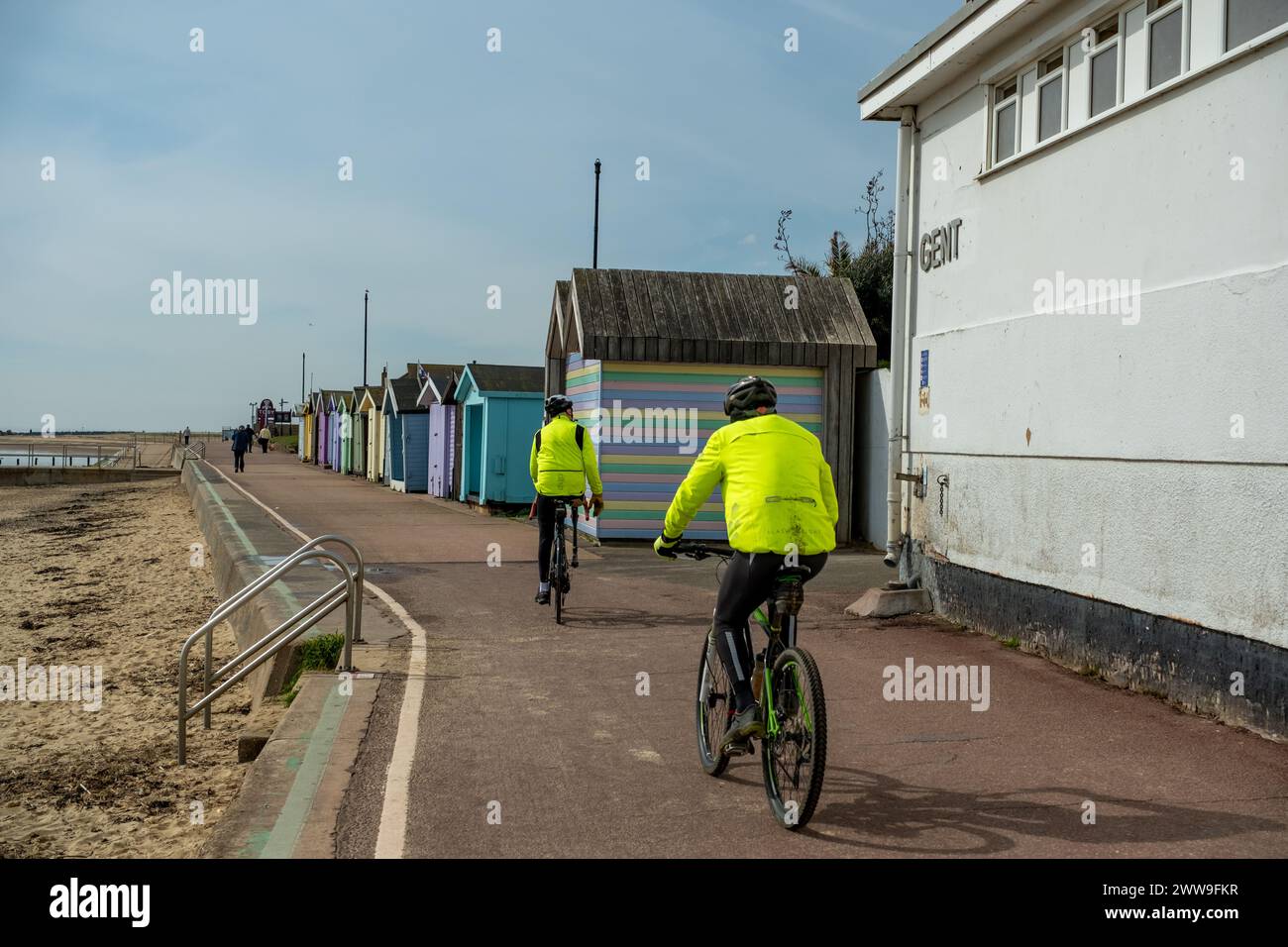 Clacton-on-Sea, Essex, UK – March 2024. Two cyclists in hi viz biking ...