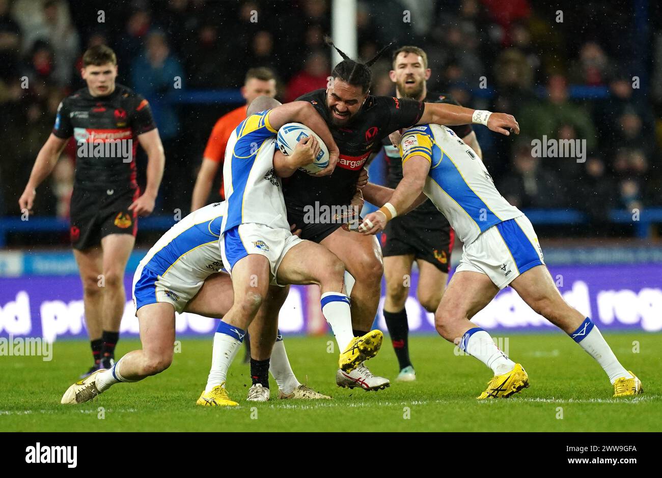 St Helens' Konrad Hurrell is tackled by Leeds Rhinos' Cameron Smith ...