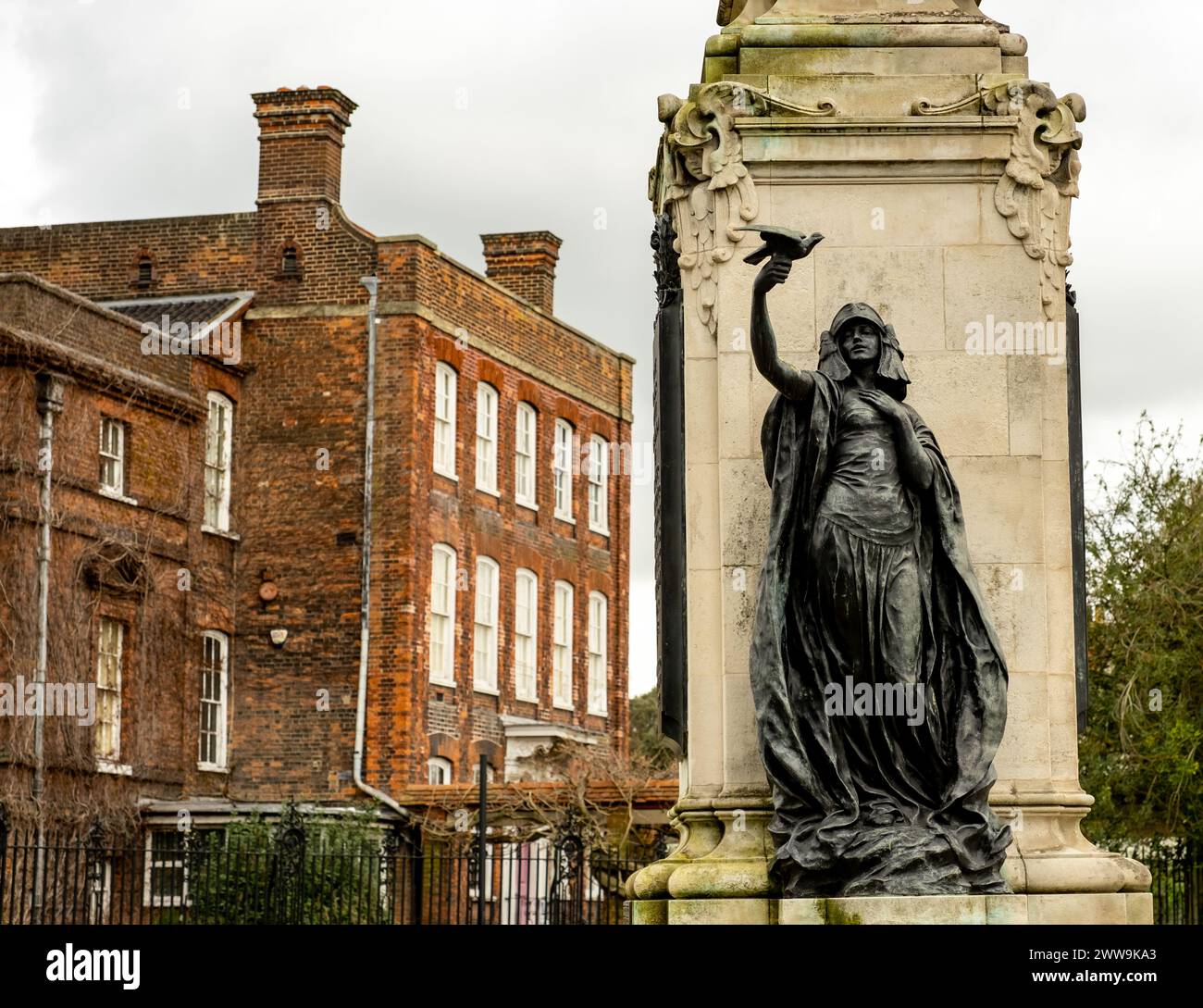 Colchester, Essex, UK – March 18 2024. Statue of a woman holding a dove ...