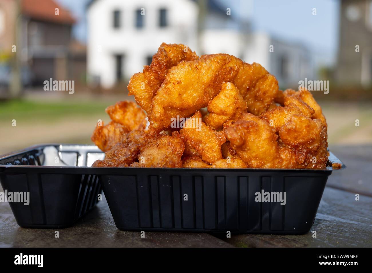 Seafood, outdoor eating of diep-fried cod fish pieces served with ...