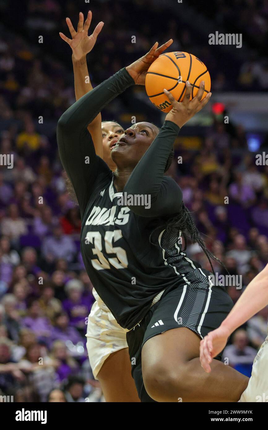Baton Rouge, LA, USA. 22nd Mar, 2024. Rice's Sussy Ngulefac (35) puts ...
