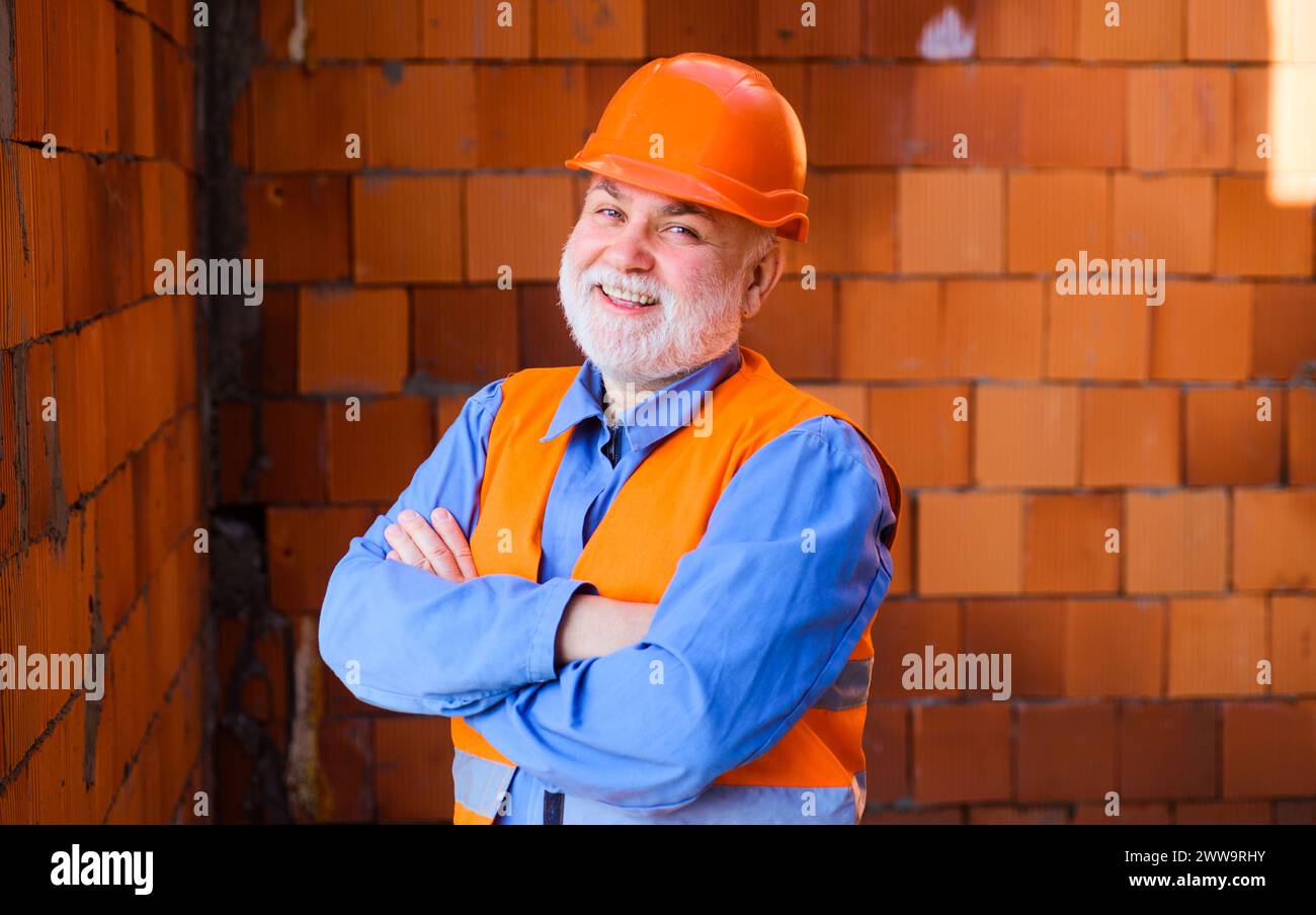 Building industry. Smiling builder man, engineer, architect in hard hat ...