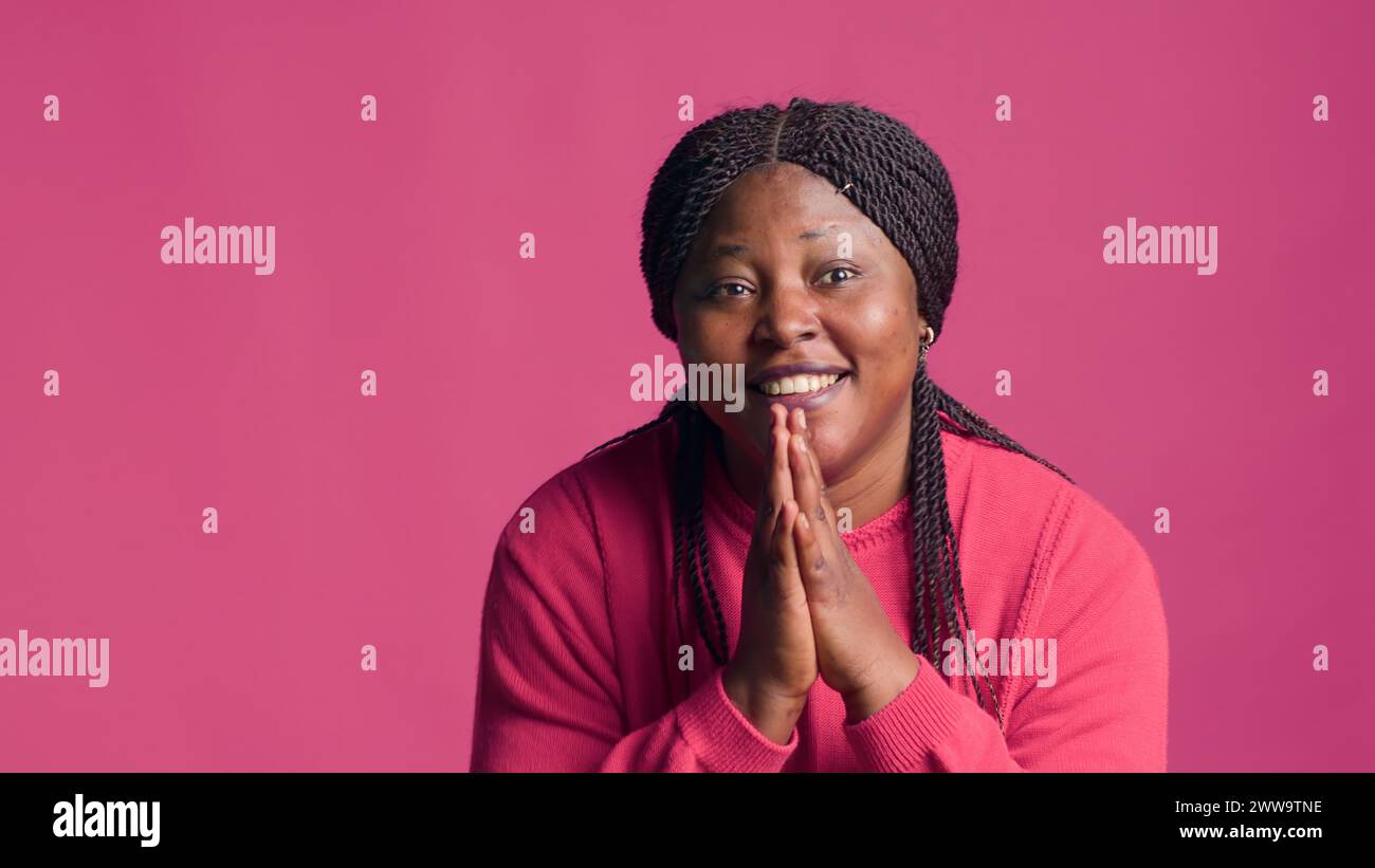 Stunning black woman looks at the camera while really pleading with her ...