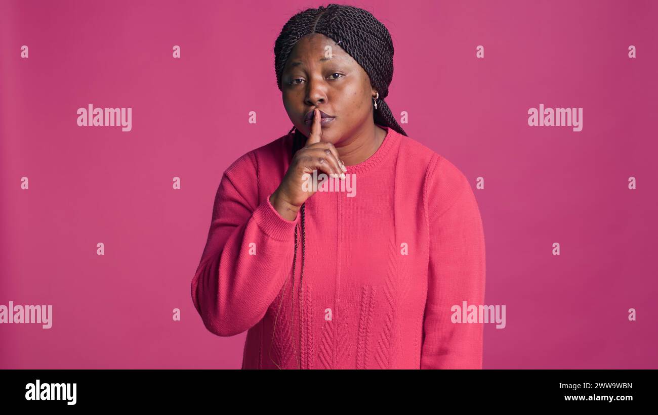 African american woman standing in front of isolated background ...