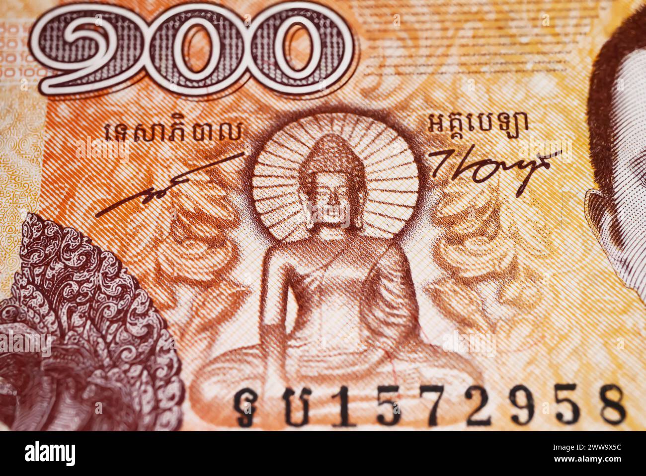 Buddha statue on Cambodia 100 Riel currency banknote (focus on center ...