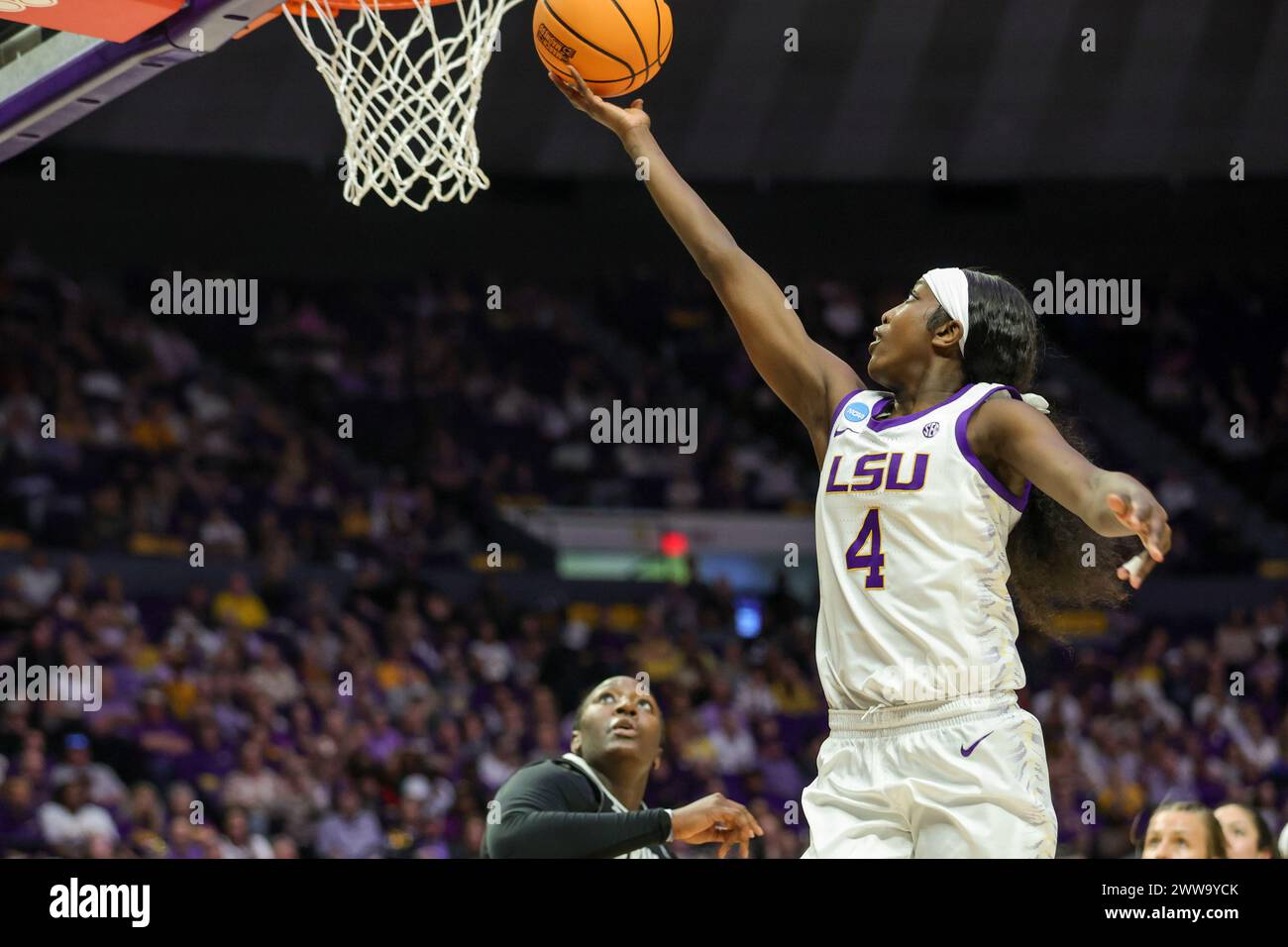 Baton Rouge, LA, USA. 22nd Mar, 2024. LSU's Flau'jae Johnson (4) drives ...