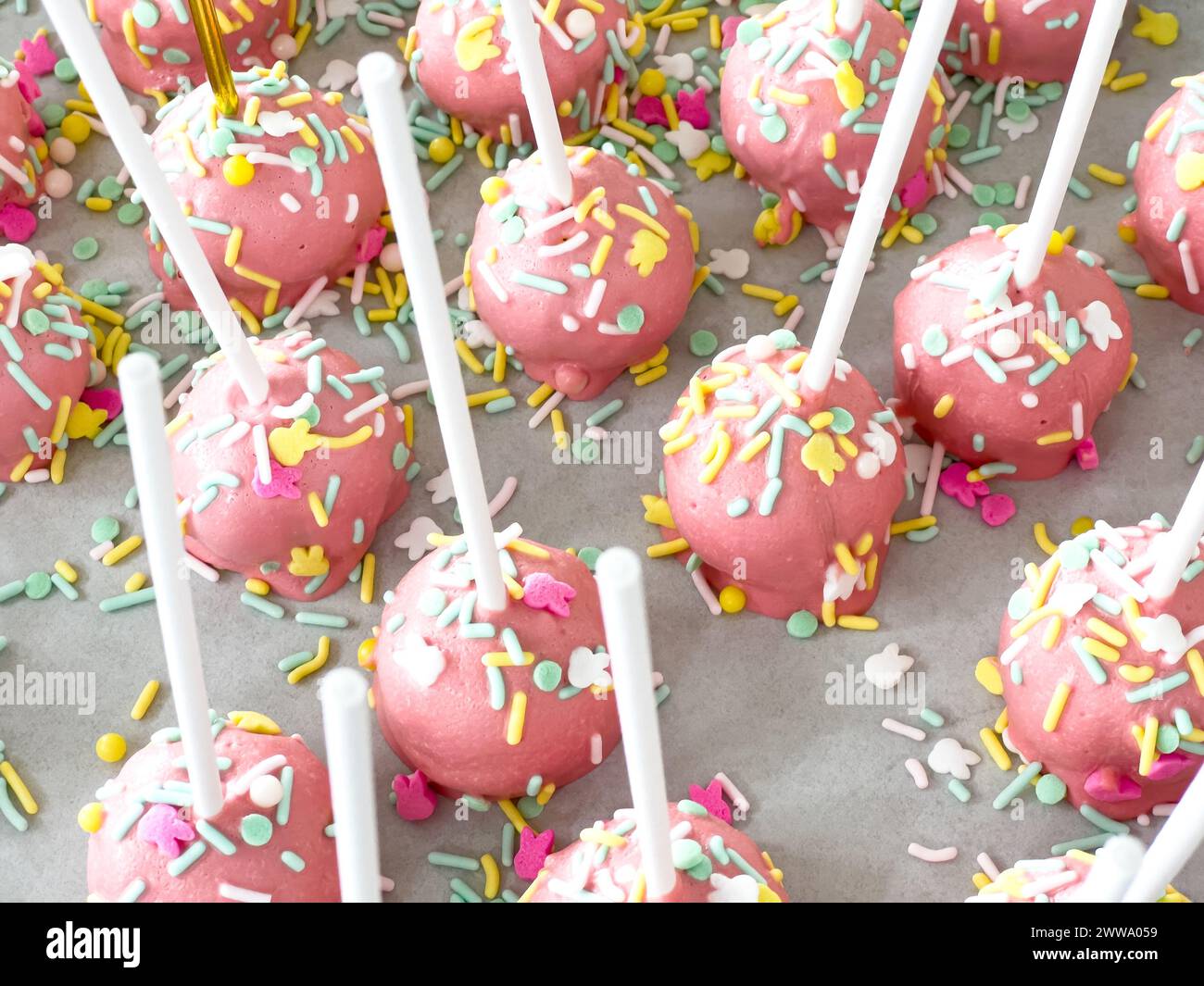 Festive Pink Cake Pops Sprinkled with Colorful Confetti Stock Photo - Alamy