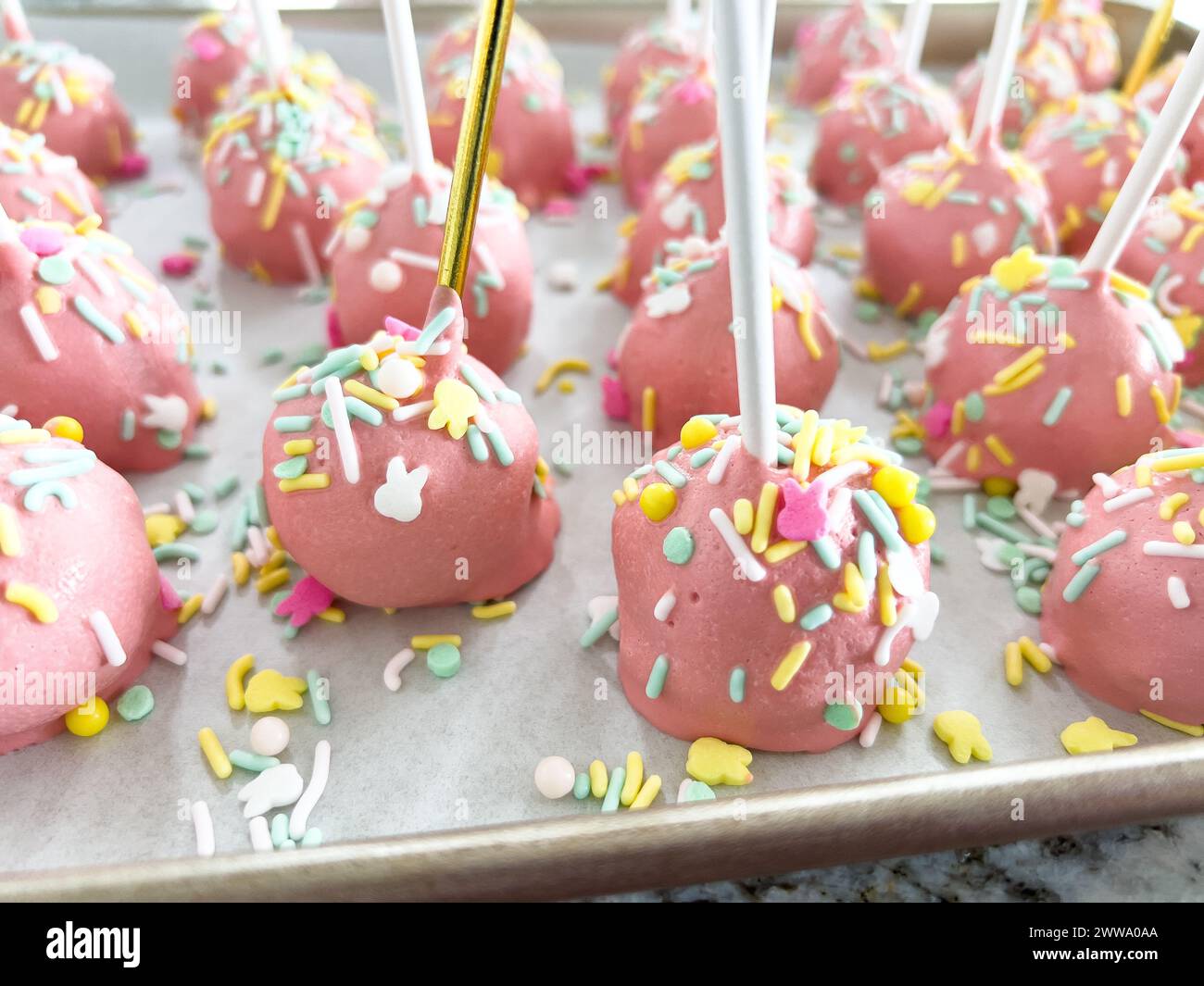Festive Pink Cake Pops Sprinkled with Colorful Confetti Stock Photo - Alamy
