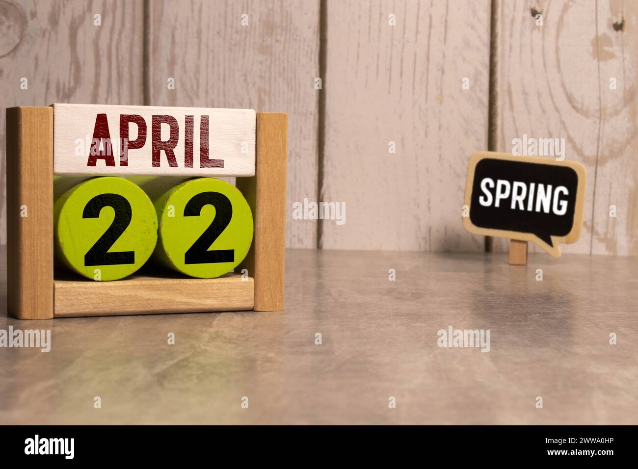 Wooden calendar on wooden desk show the date of April 22 , earth day ...