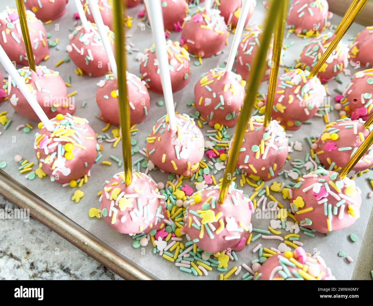 Festive Pink Cake Pops Sprinkled with Colorful Confetti Stock Photo - Alamy