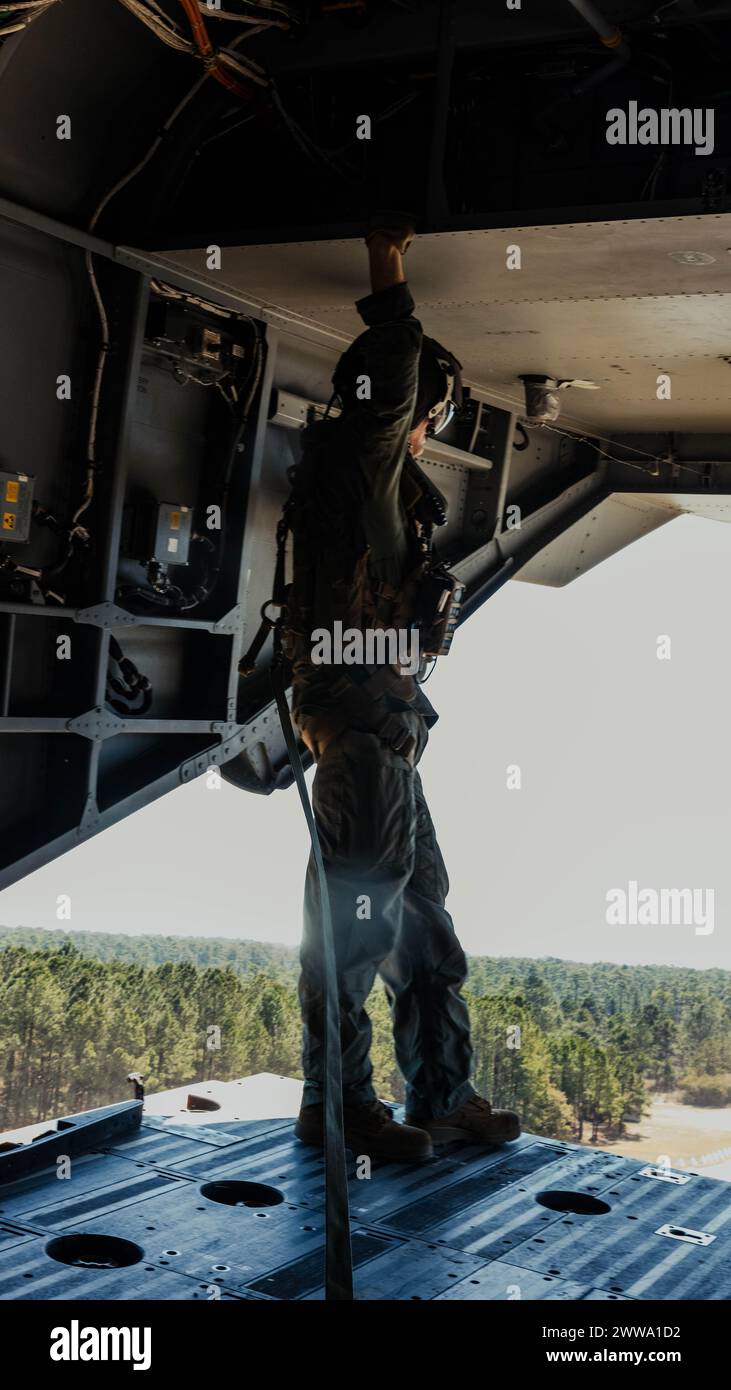A U.S. Marine with 2d Marine Air Wing, 2d Marine Division scans the ...