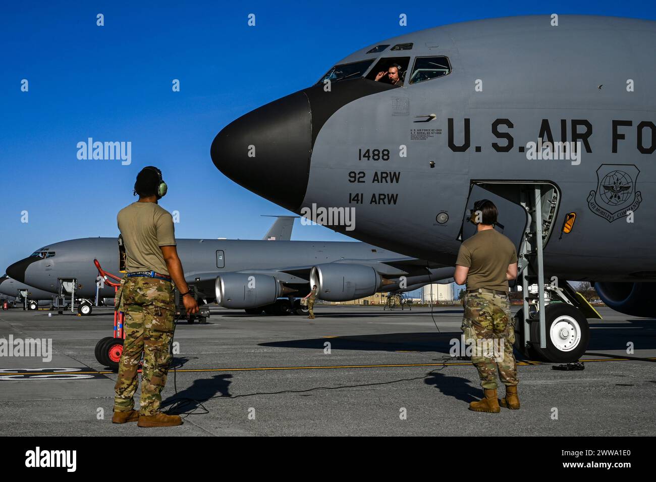 Airmen assigned to the 92nd Air Refueling Wing conduct a pre-flight inspection on a KC-135 ...
