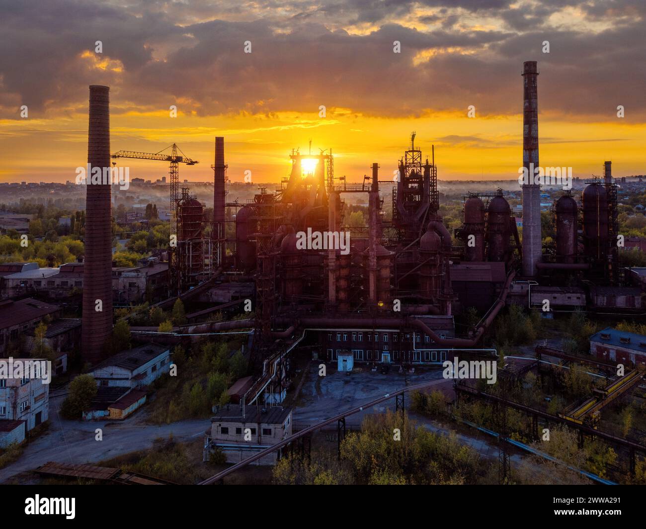 Blast furnace equipment of the metallurgical plant at the sunset ...