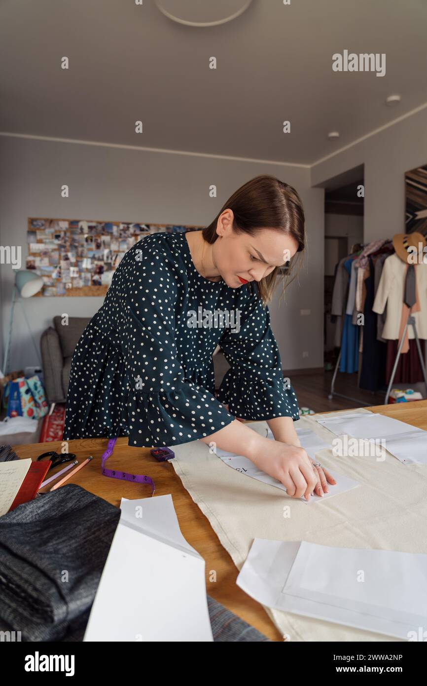 Fashion designer at work on a new clothing line Stock Photo - Alamy