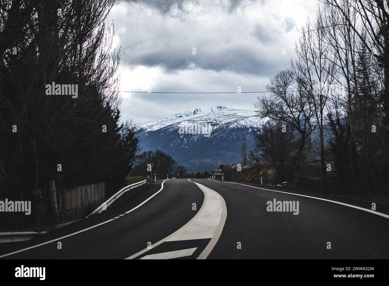 Empty misty road through winter forest. Scenic picturesque route. Sense ...