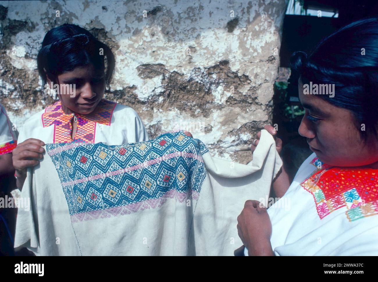 Chamula Tzotzil speaking Maya Indian woman weavers inspect the ...