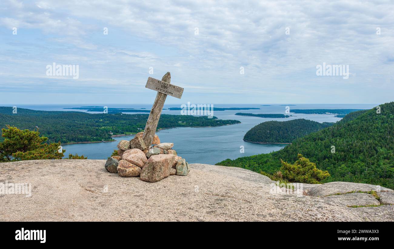 Acadia Mountain summit marker, overlooking a scenic coastal landscape ...