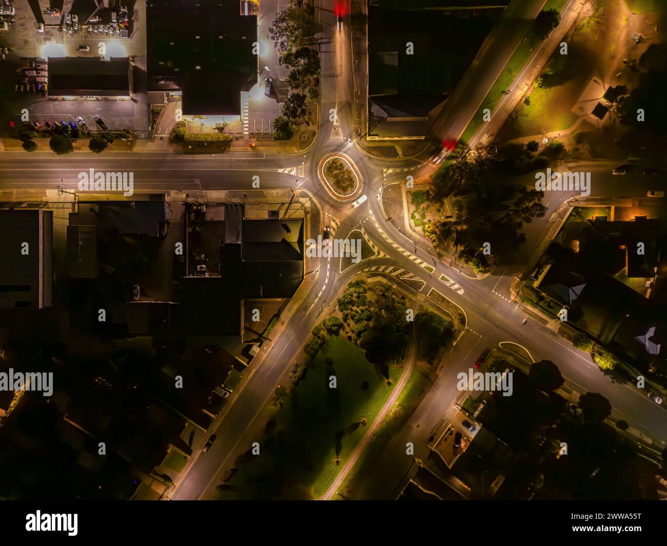 Aerial view of city streets at night with vibrant lights and traffic ...
