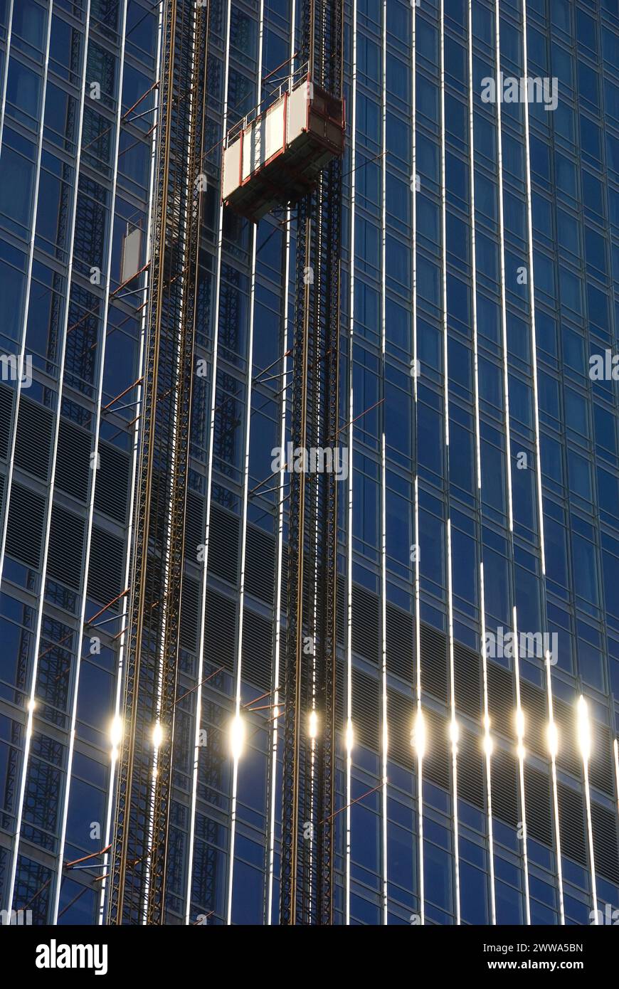 elevators on side of glass tower during construction of Trump Tower ...