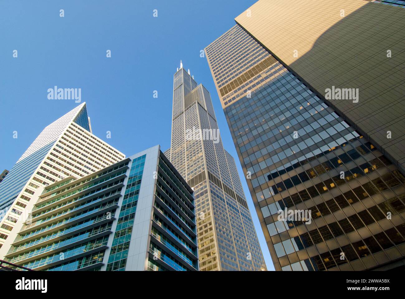 Sears Tower framed by high rises aligning the Chicago River - at 110 ...
