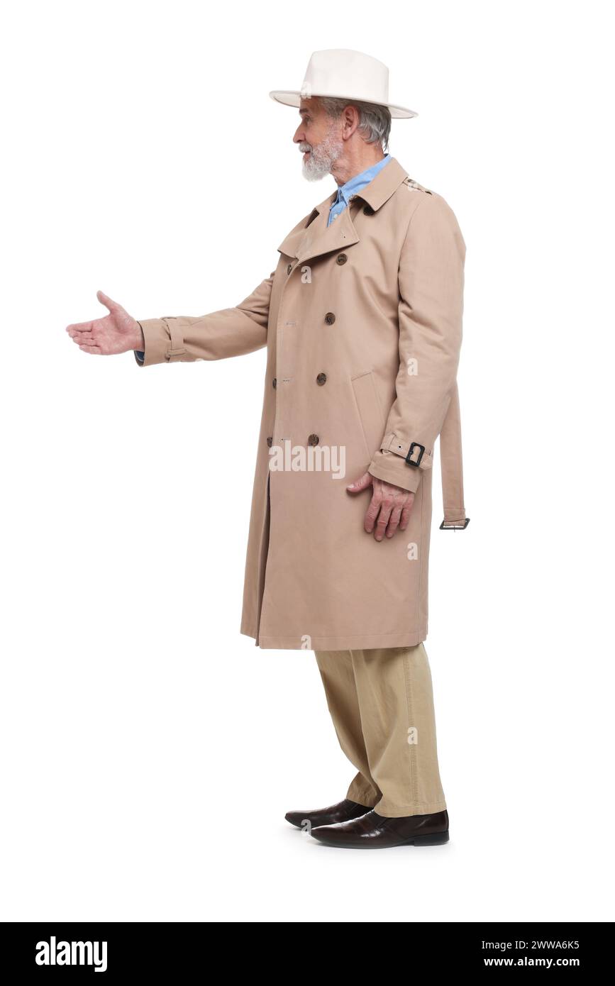 Senior man greeting someone on white background Stock Photo - Alamy