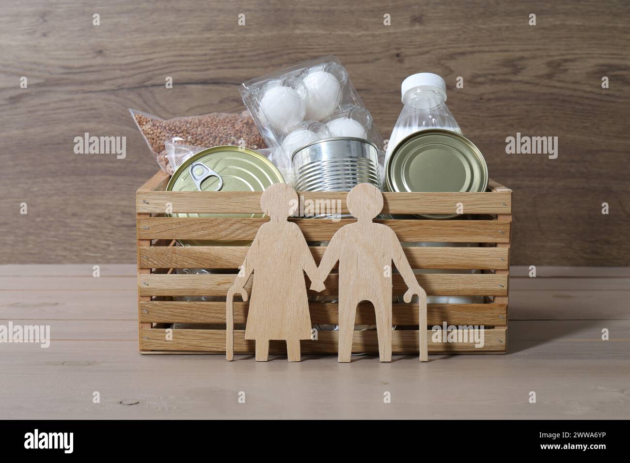Humanitarian aid for elderly people. Donation box with food products ...