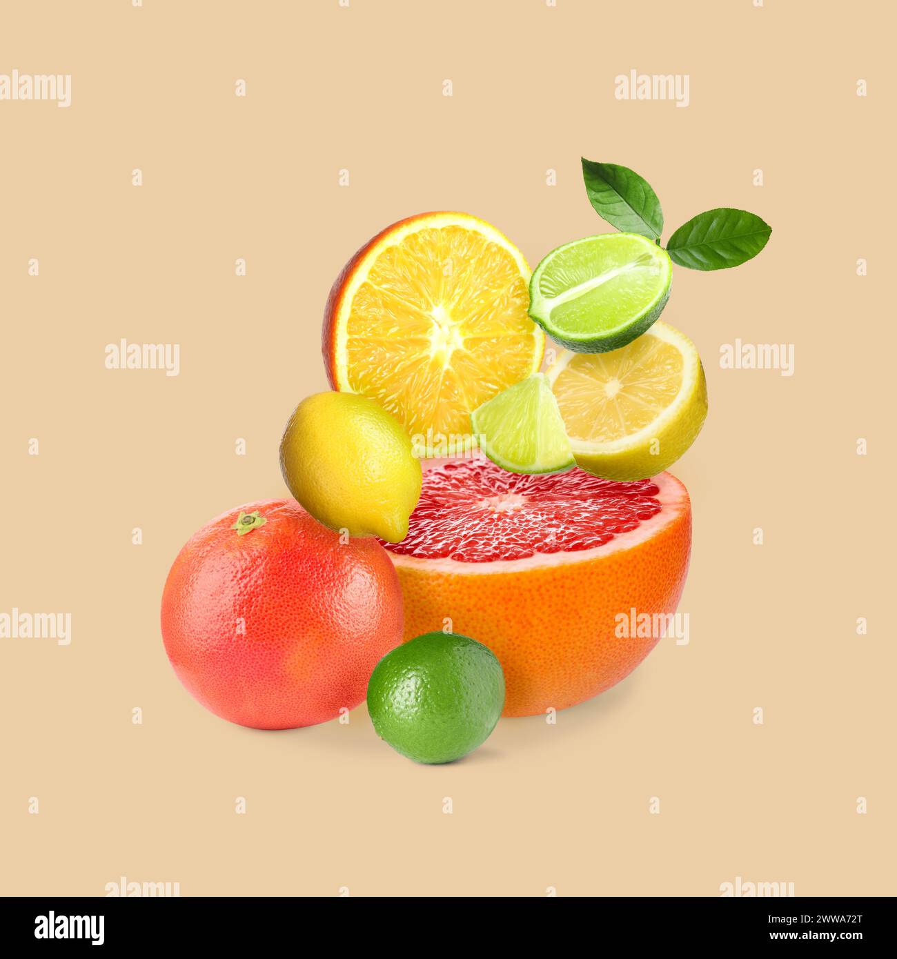 Stack of different citrus fruits on beige background Stock Photo - Alamy