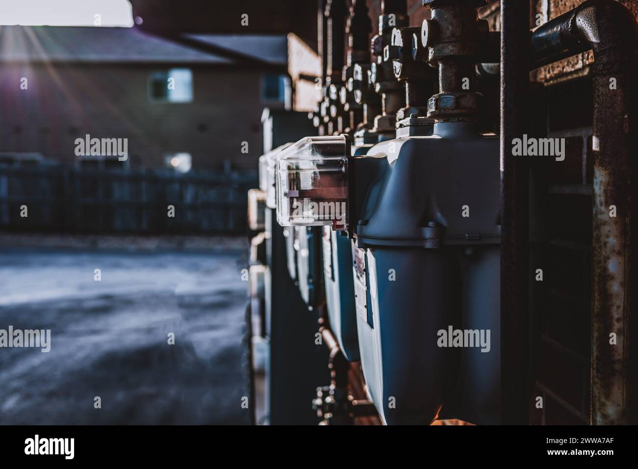 Row of gas utility meters on the outside wall of an apartment building ...