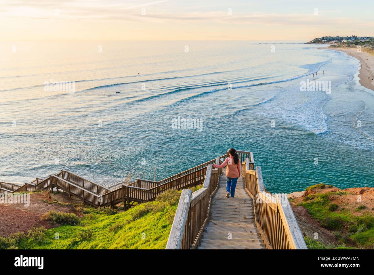 Woman gracefully descends the South Port Beach stairs captivated by the ...