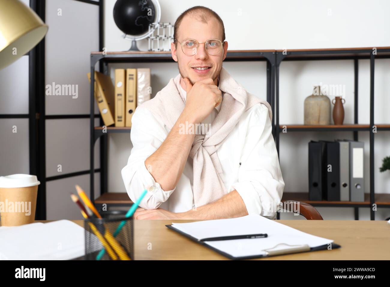 Male tutor giving online lesson at home Stock Photo - Alamy