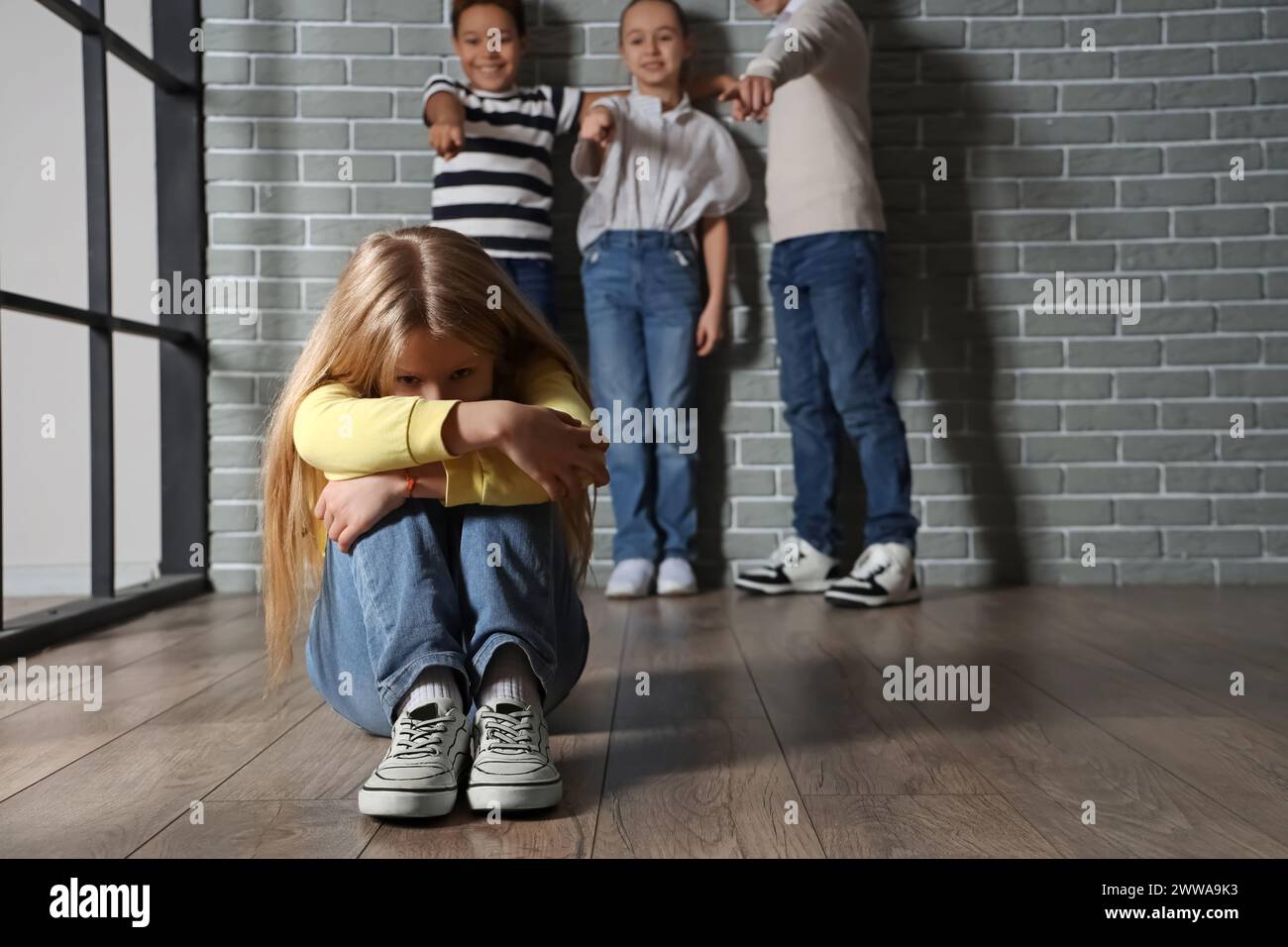 Bullied little girl crying at school Stock Photo - Alamy