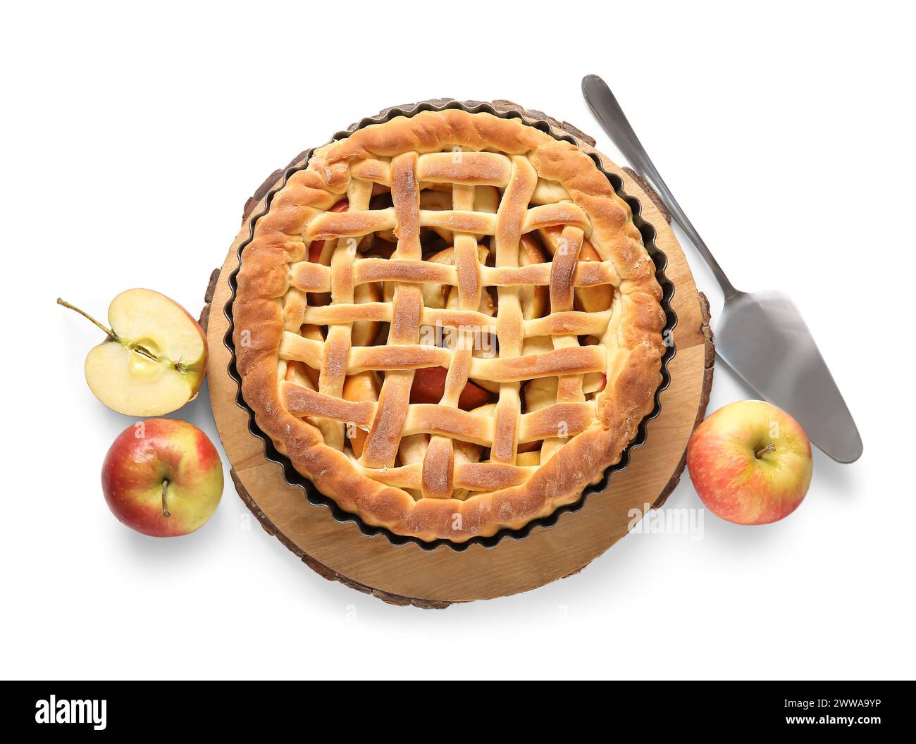 Wooden tray with tasty homemade apple pie, fruits and spatula on white ...