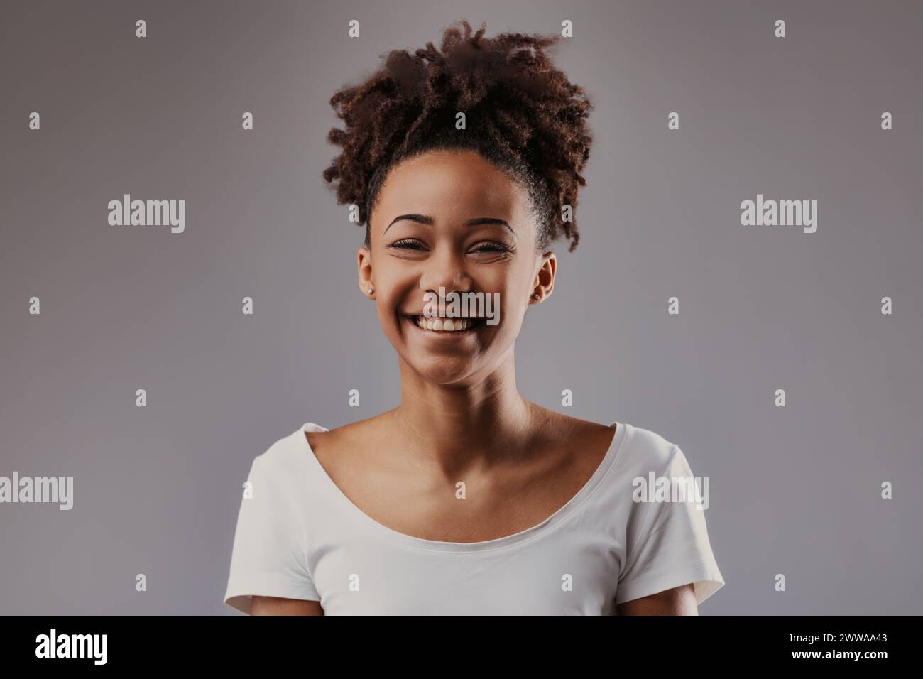 Effervescence captured in her grin, eyes sparkling with vivacious ...