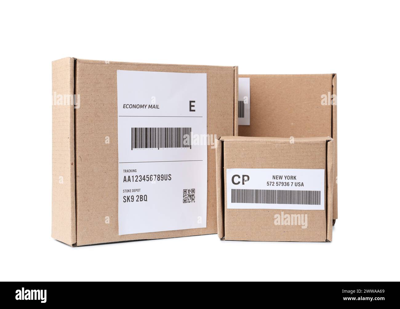 Cardboard packages with shipping labels and barcodes on white ...