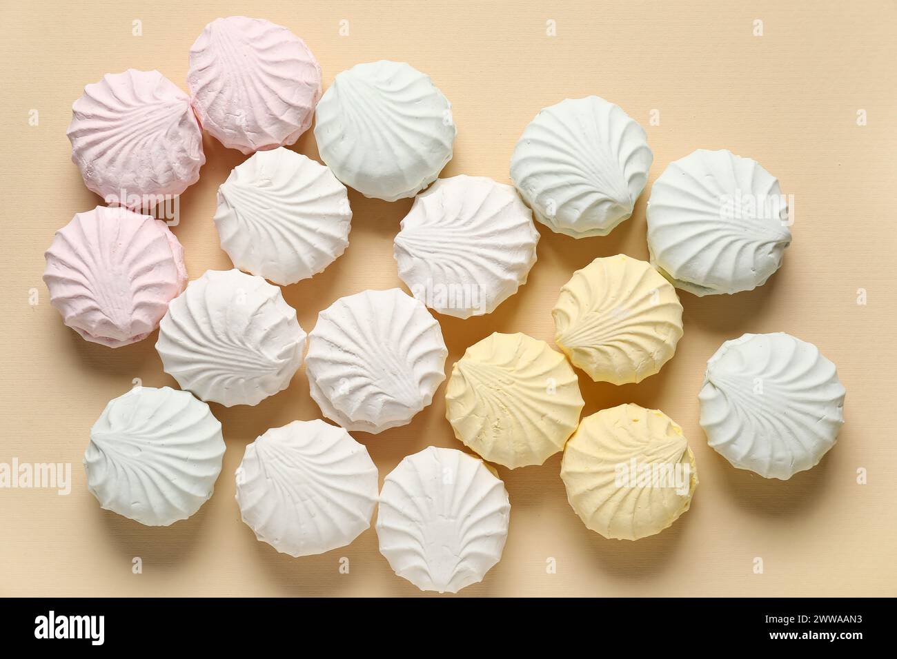 Many sweet zephyr on beige background Stock Photo - Alamy