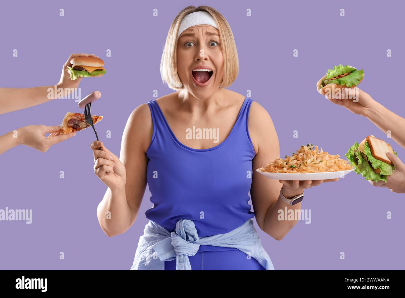 Shocked sporty woman and hands with unhealthy food on lilac background ...