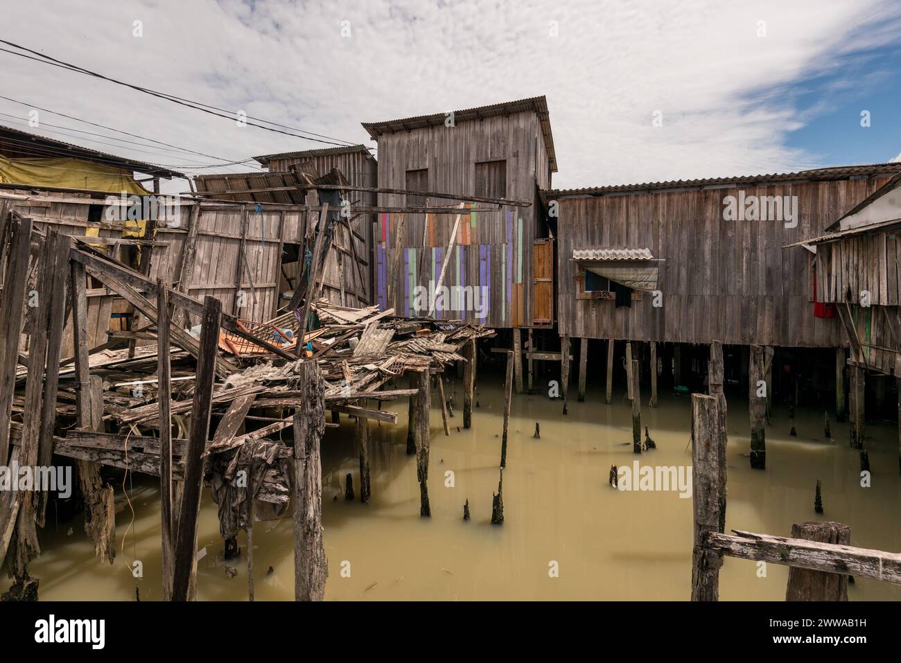 Wooden Houses of the Slum Built Above Water in Poor Neighborhood of ...