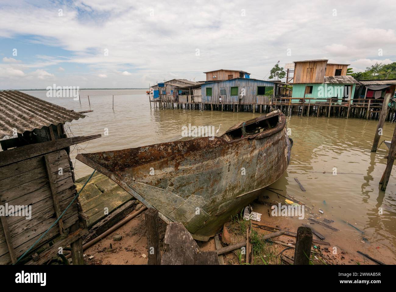 Wooden Houses of the Slum Built Above Water in Poor Neighborhood of ...