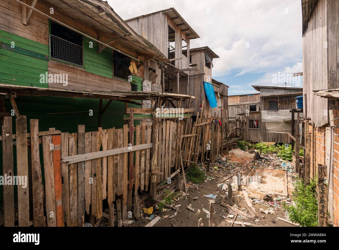 Wooden Houses of the Slum Built Above Water in Poor Neighborhood of ...