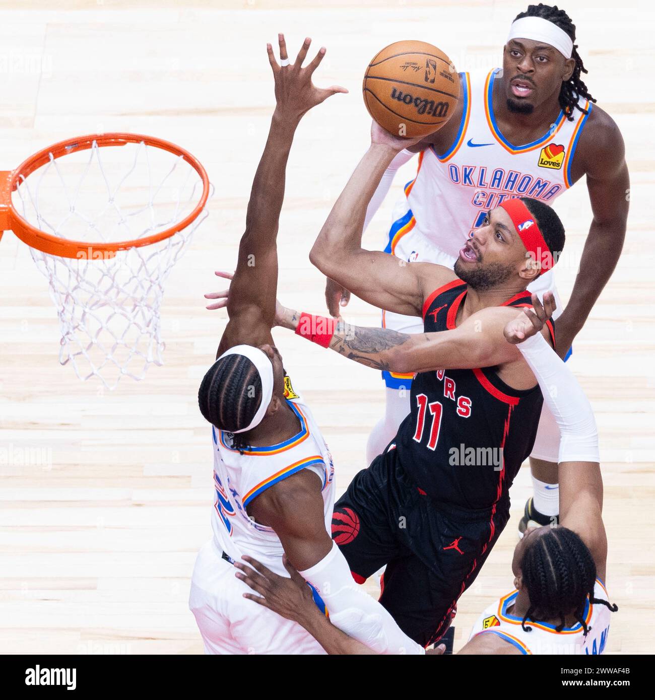 Toronto, Canada. 22nd Mar, 2024. Bruce Brown Jr. (C) of Toronto Raptors ...