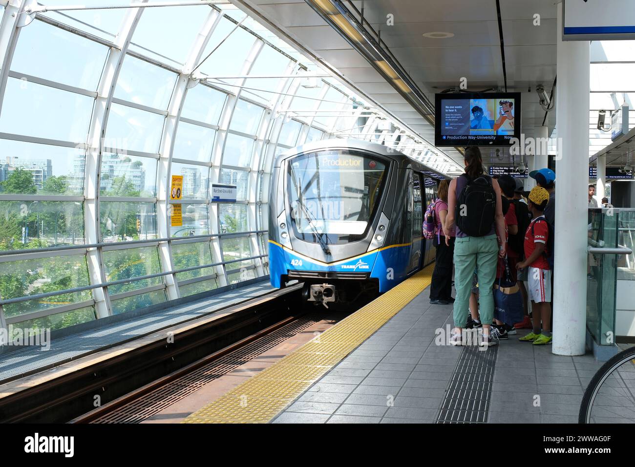 Blue line Skytrain train runs from waterfront to King's George metro ...
