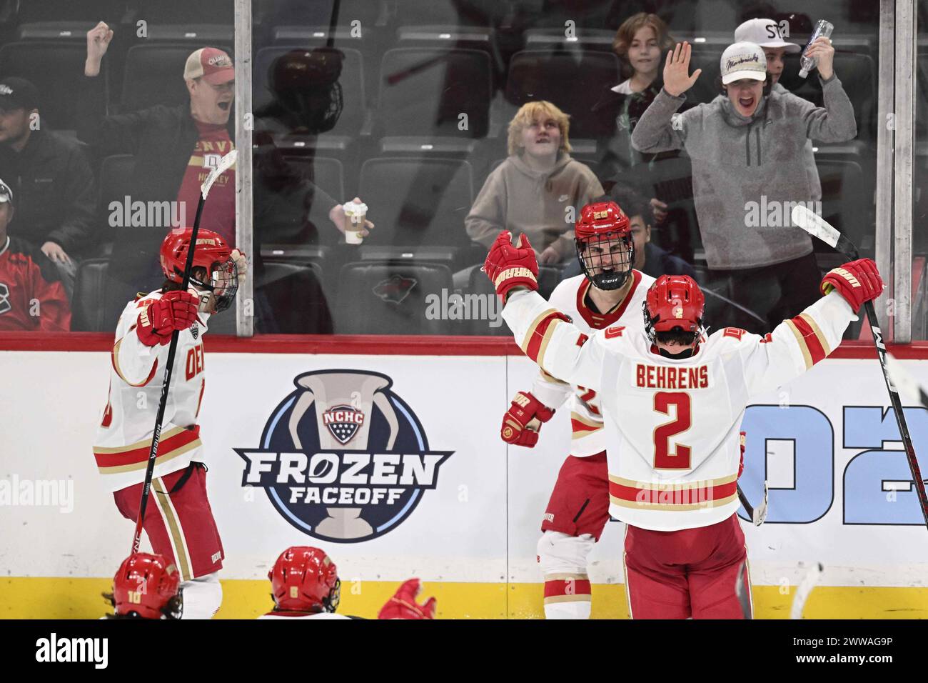 Denver Pioneers defenseman Sean Behrens (2) moves to celebrate with ...