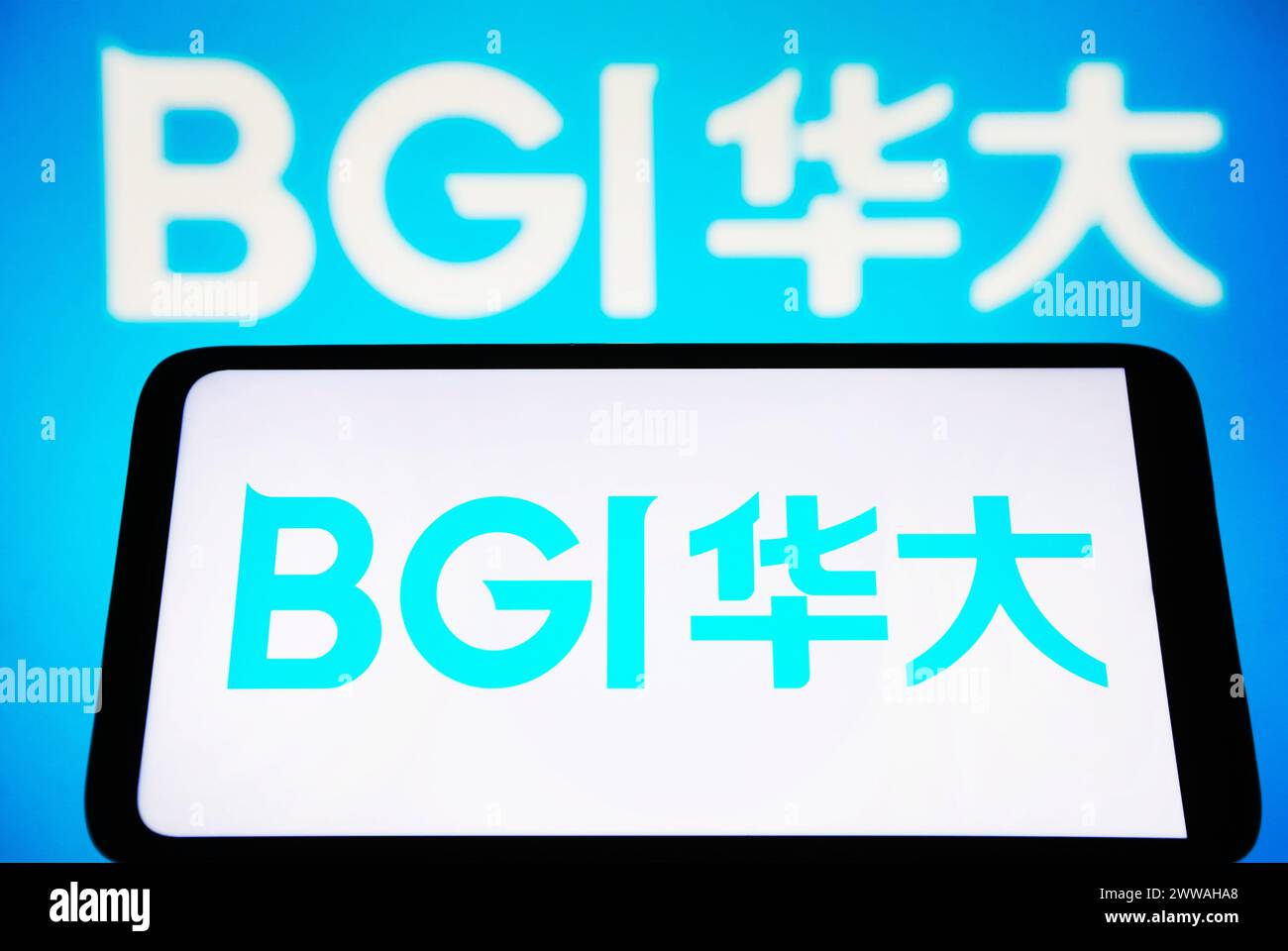 In this photo illustration, BGI Group logo is seen on a smartphone and ...