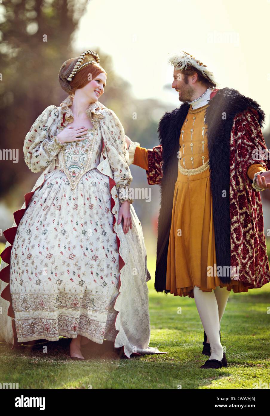 Medieval, lawn and couple in history with renaissance fashion outdoor ...