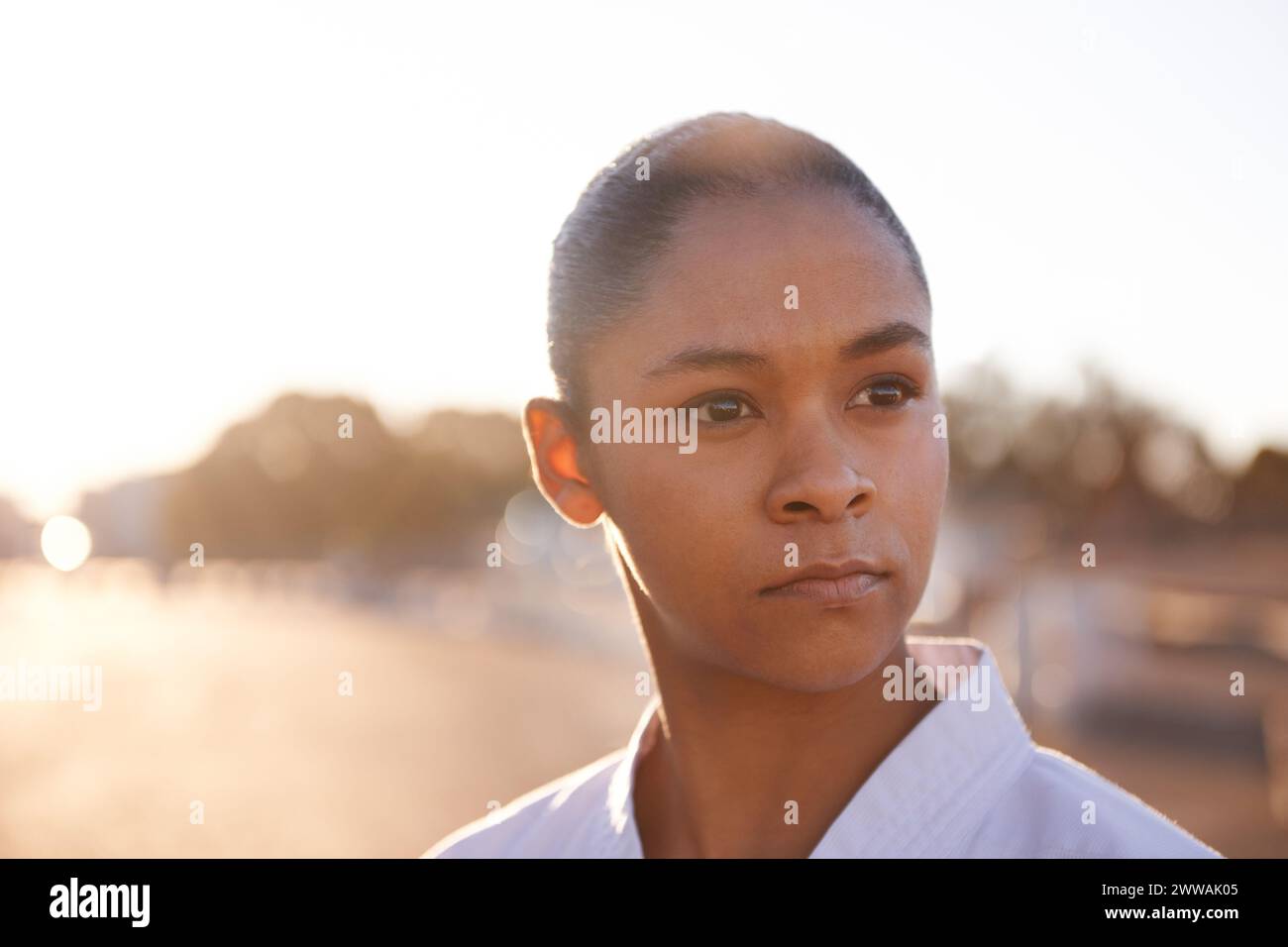 Serious woman, face and thinking with karate Gi, self defense training ...
