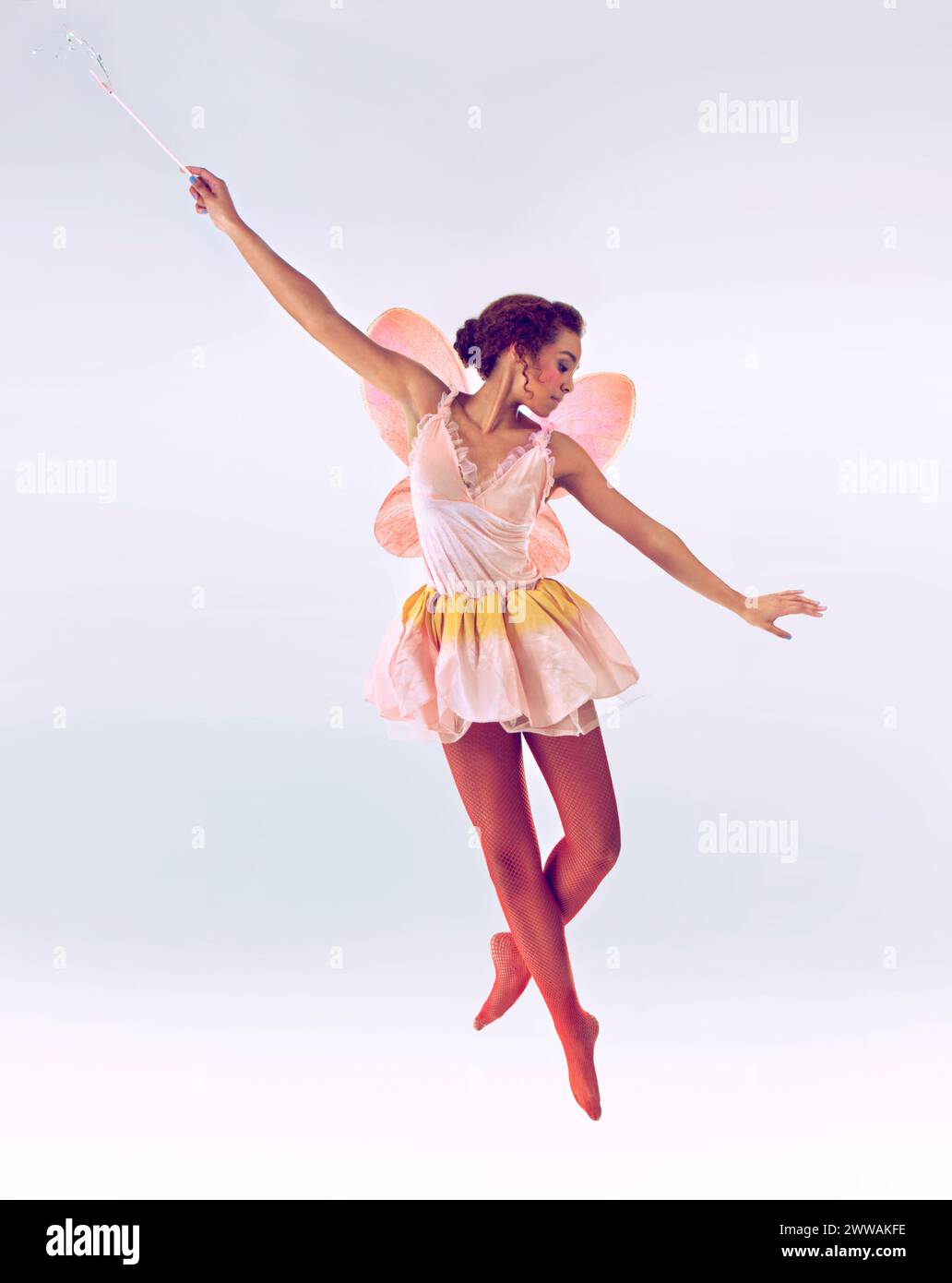 Woman, fairy and dancer for wand in studio for fantasy, flight and ...