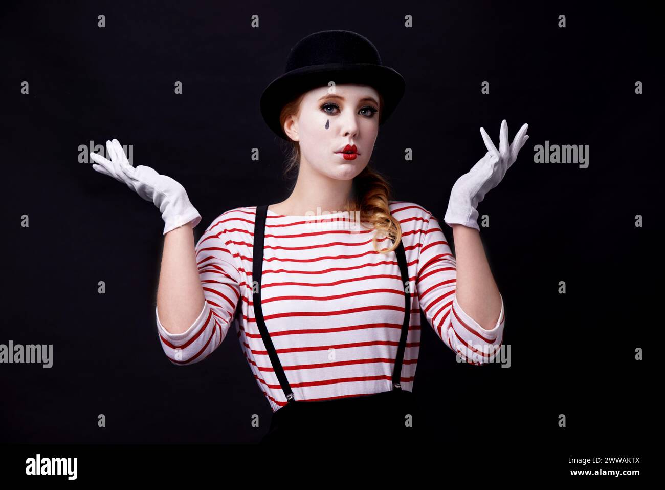Woman, costume and mime for performance in studio on dark background ...