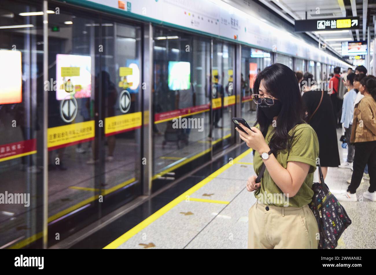 Girl waiting metro train in Chen Clan Academy Station, Guangzhou city ...