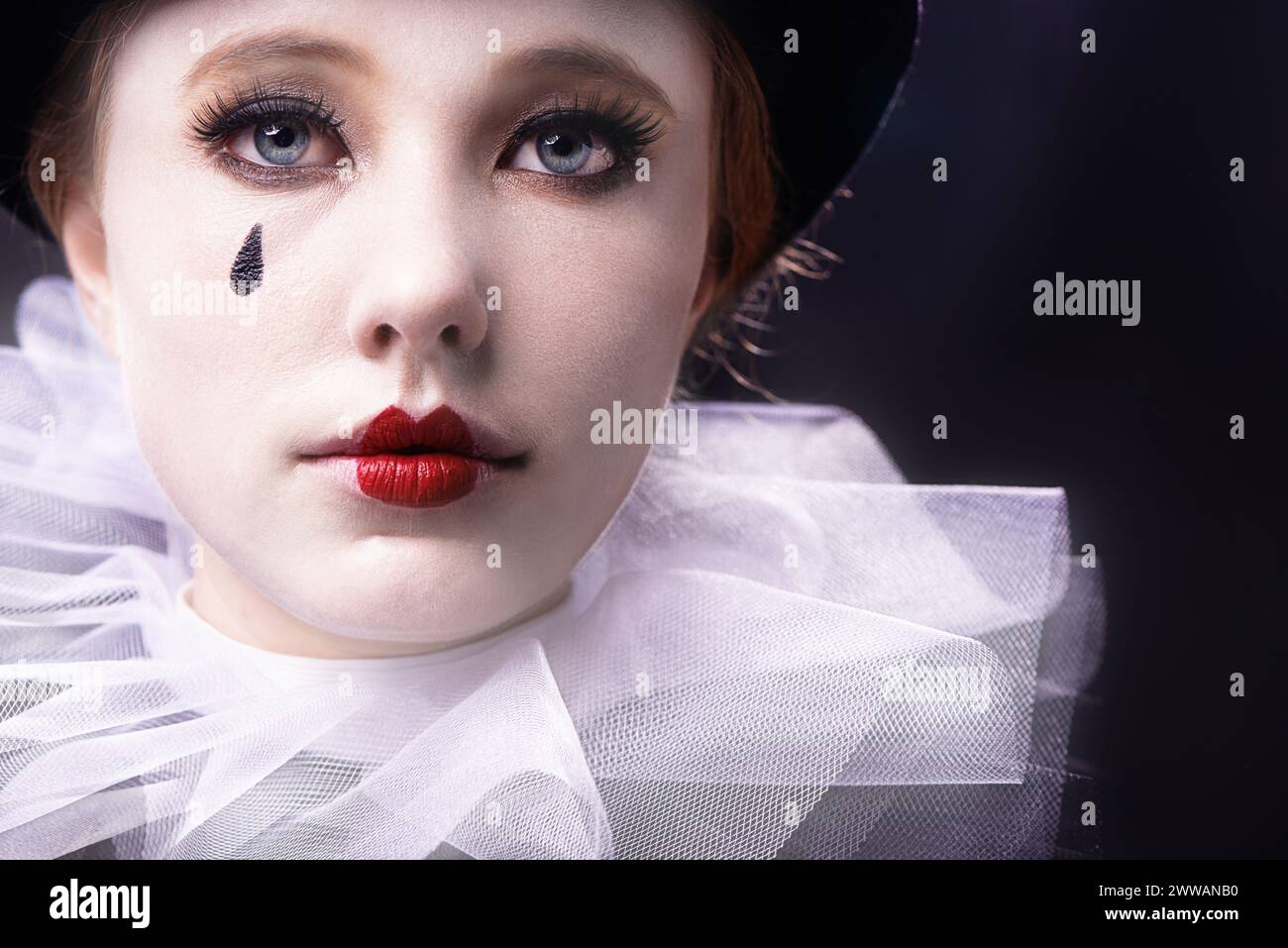 Face, woman and magician performer in studio on black background with ...