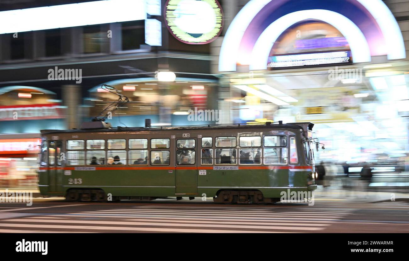 The Sapporo Streetcar with red line runs in Sapporo City, Hokkaido ...